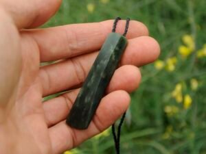 Chatoyant Inanga Pounamu Toki — A Carved Piece
