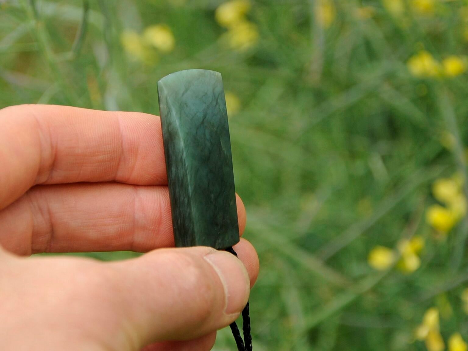 Chatoyant Inanga Pounamu Toki — A Carved Piece