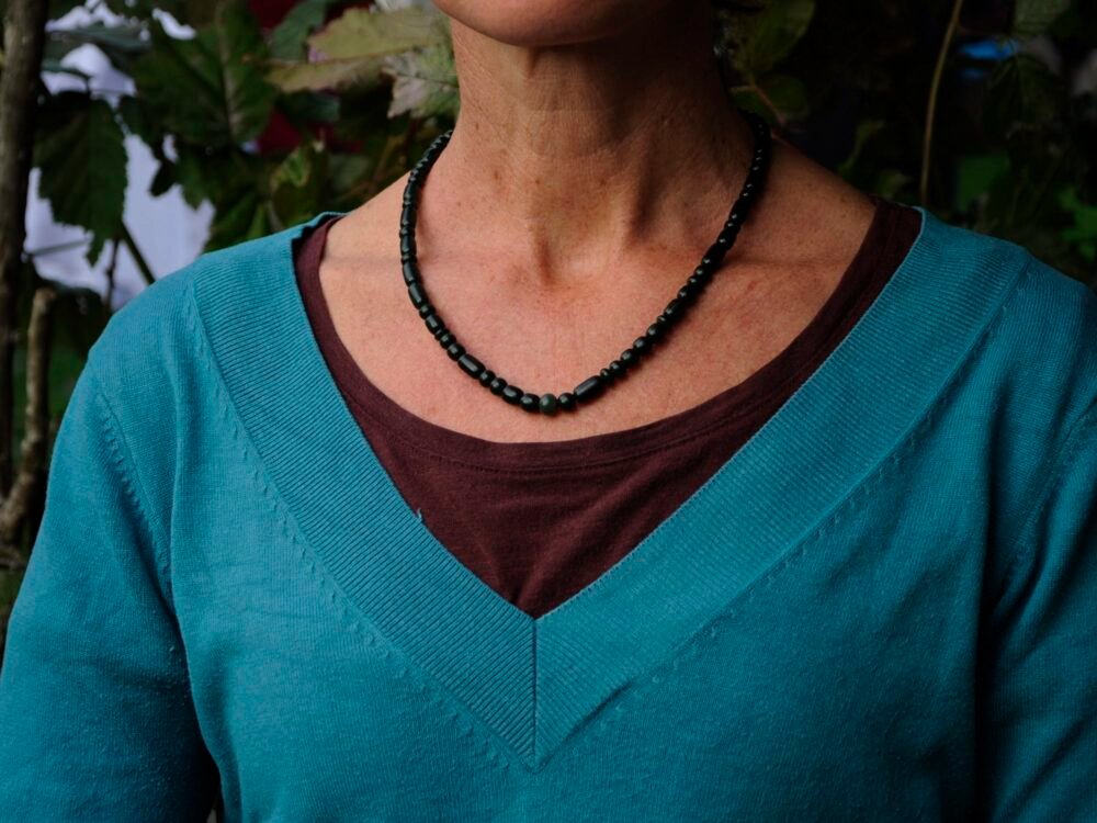 Green and inanga pounamu bead strand — A Carved Piece